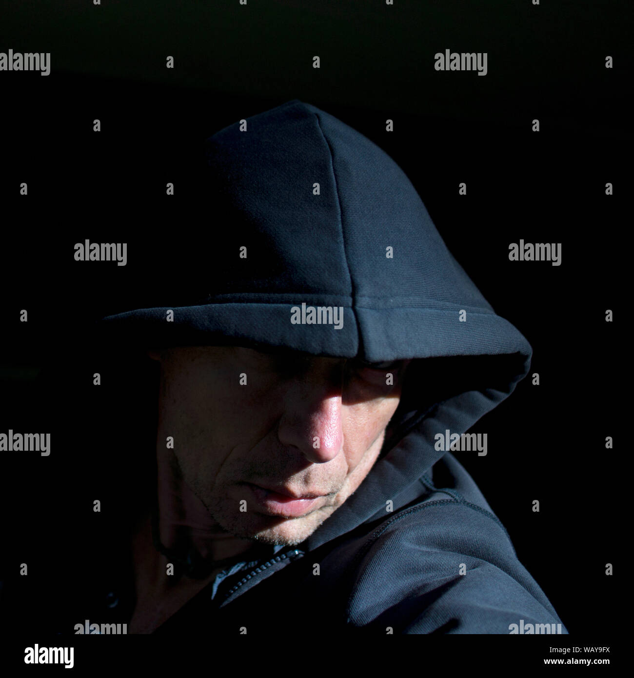 Head and Shoulders Portrait of Man Wearing Hood Stock Photo - Alamy