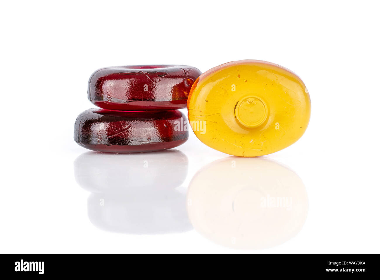 Group of three whole colourful hard candy isolated on white background ...