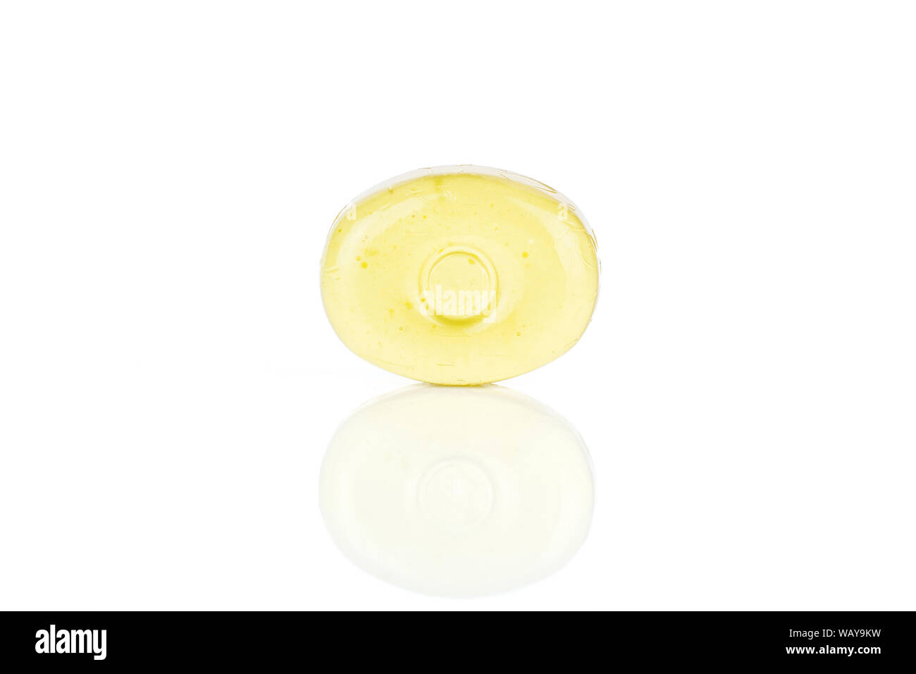 One whole yellow colourful hard candy isolated on white background ...