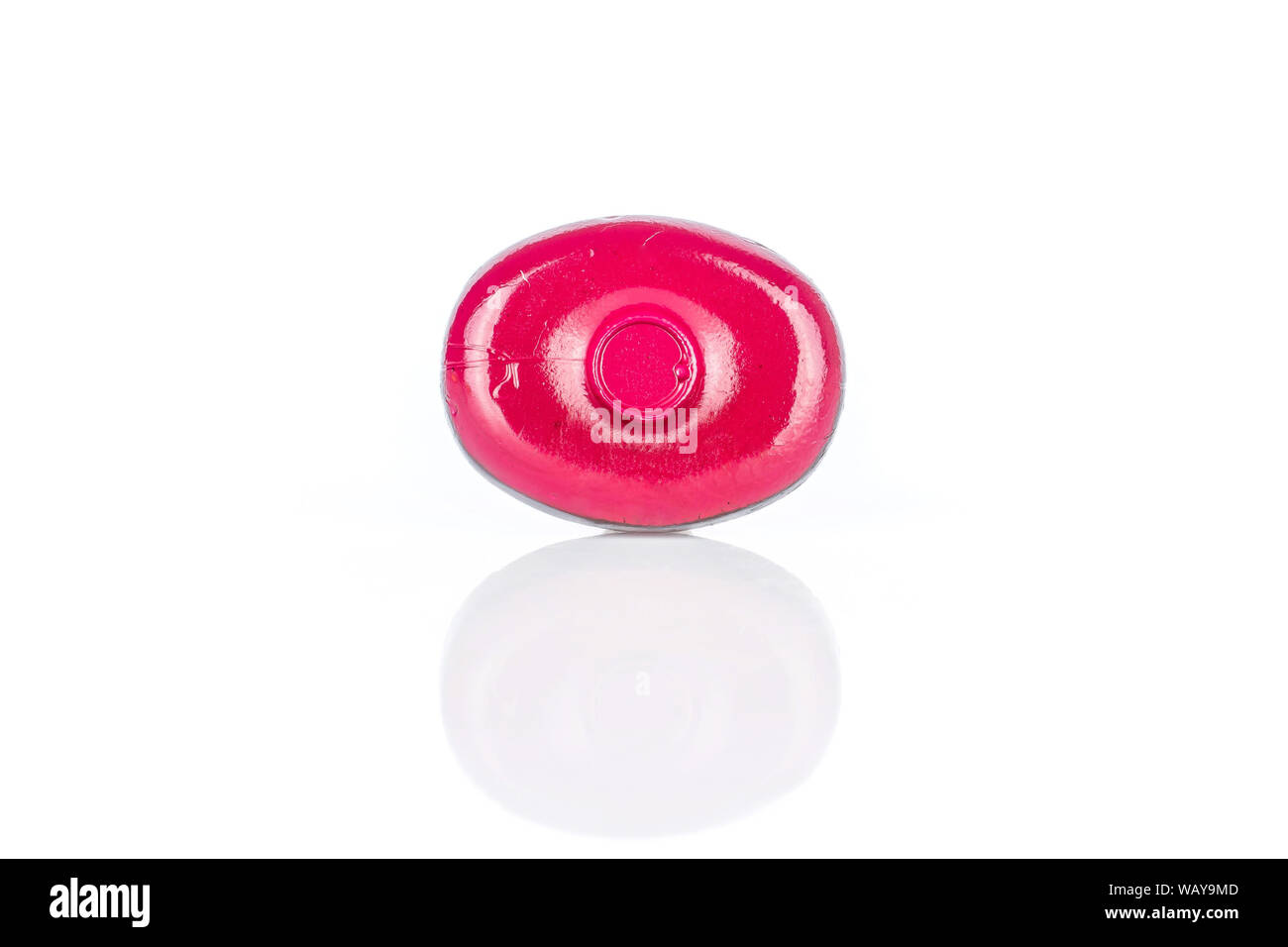 One whole dark red colourful hard candy isolated on white background ...