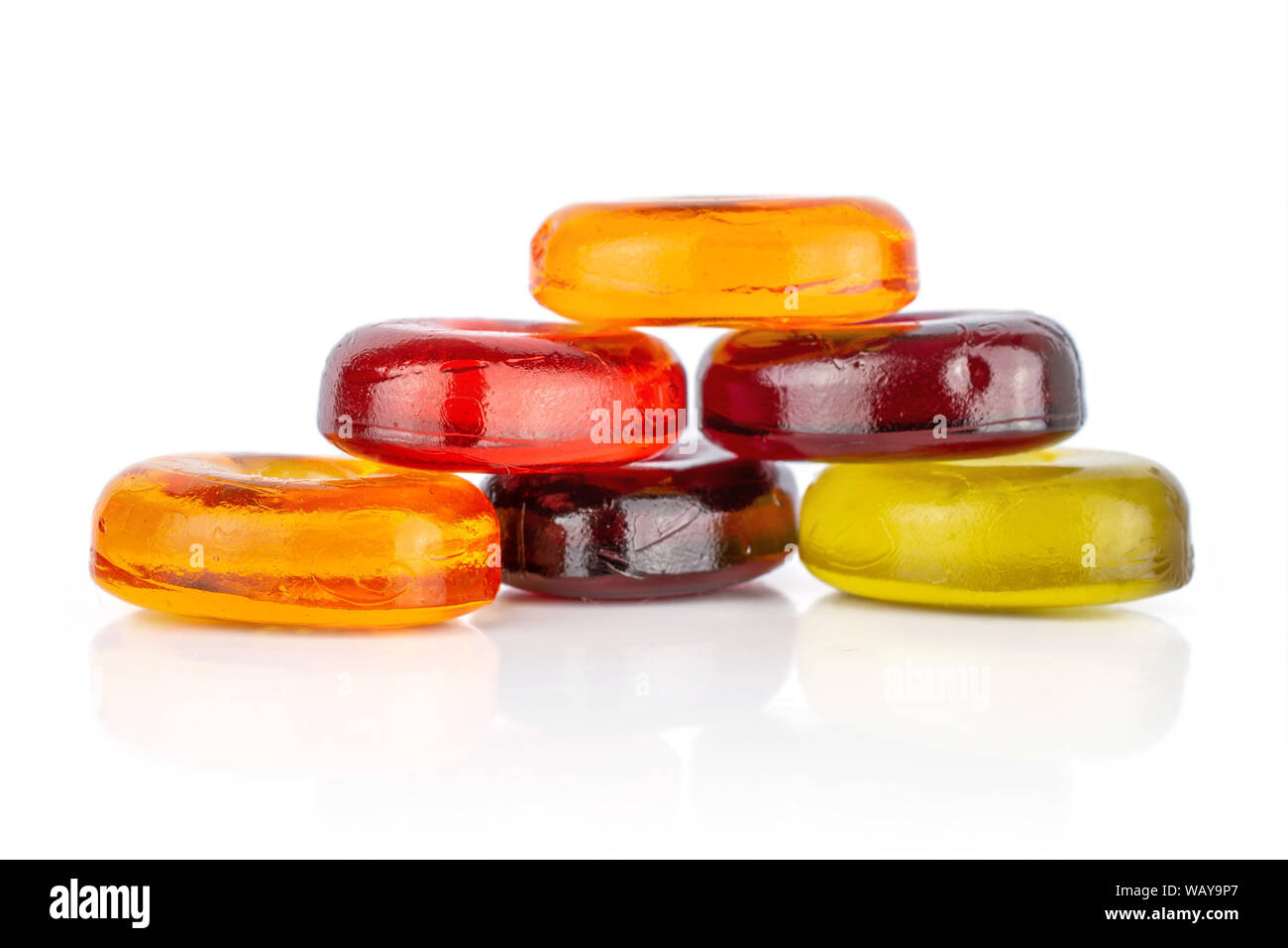 Group of six whole colourful hard candy pyramid isolated on white ...