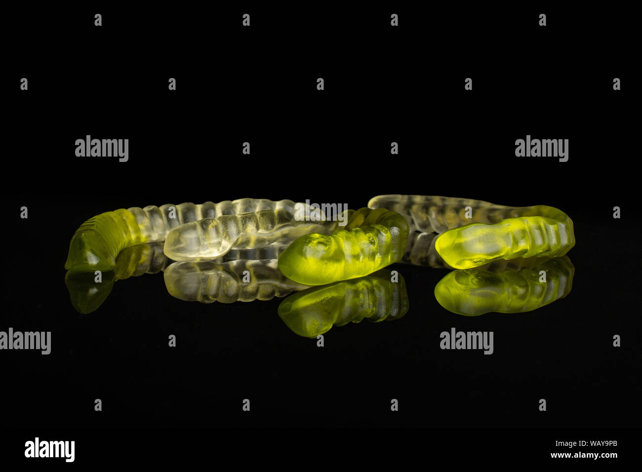 Group of three whole green white colourful jelly worm candy isolated on ...