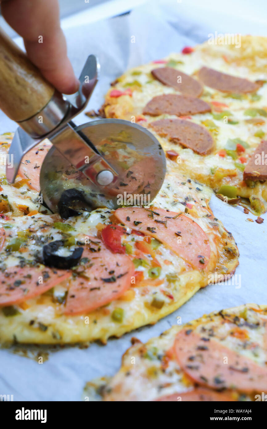 Frozen Italian pizza ready to be baked Stock Photo - Alamy