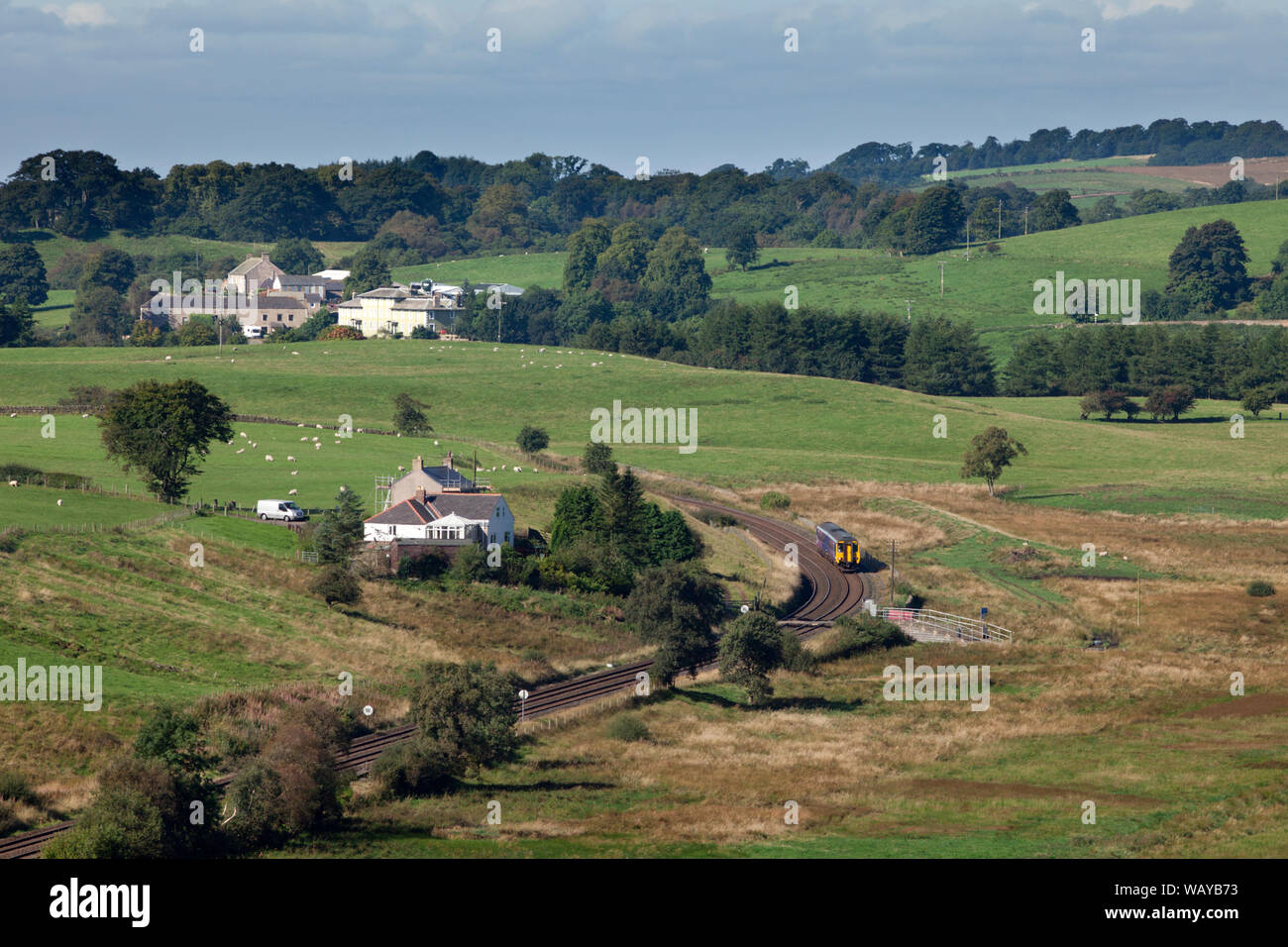Arriva Northern rail class 156 sprinter train passing baron house ...
