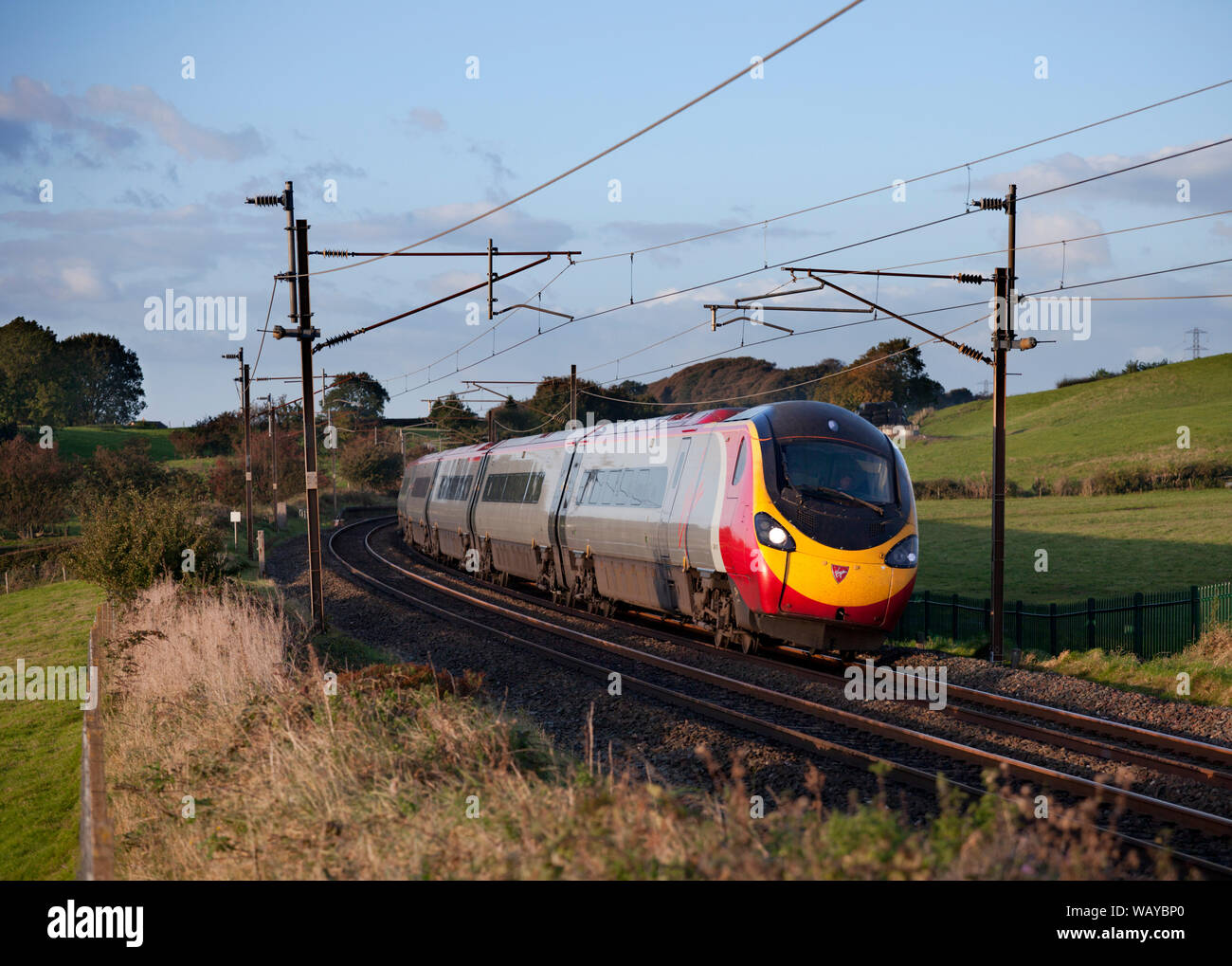 Virgin trains pendolino train tilting round a curve on the west coast ...
