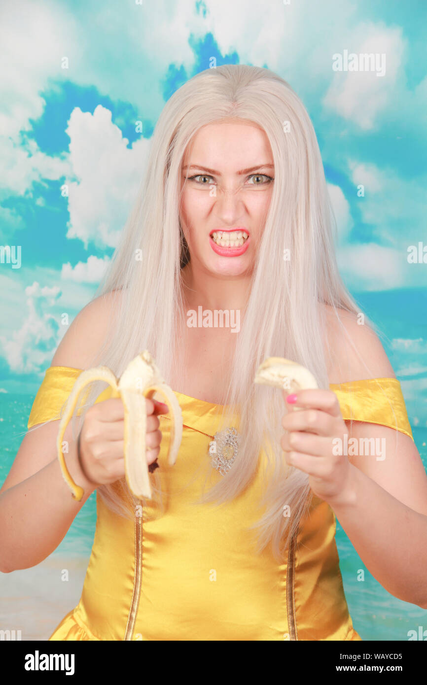 pretty angry sad unhappy female on blue studio background Stock Photo ...