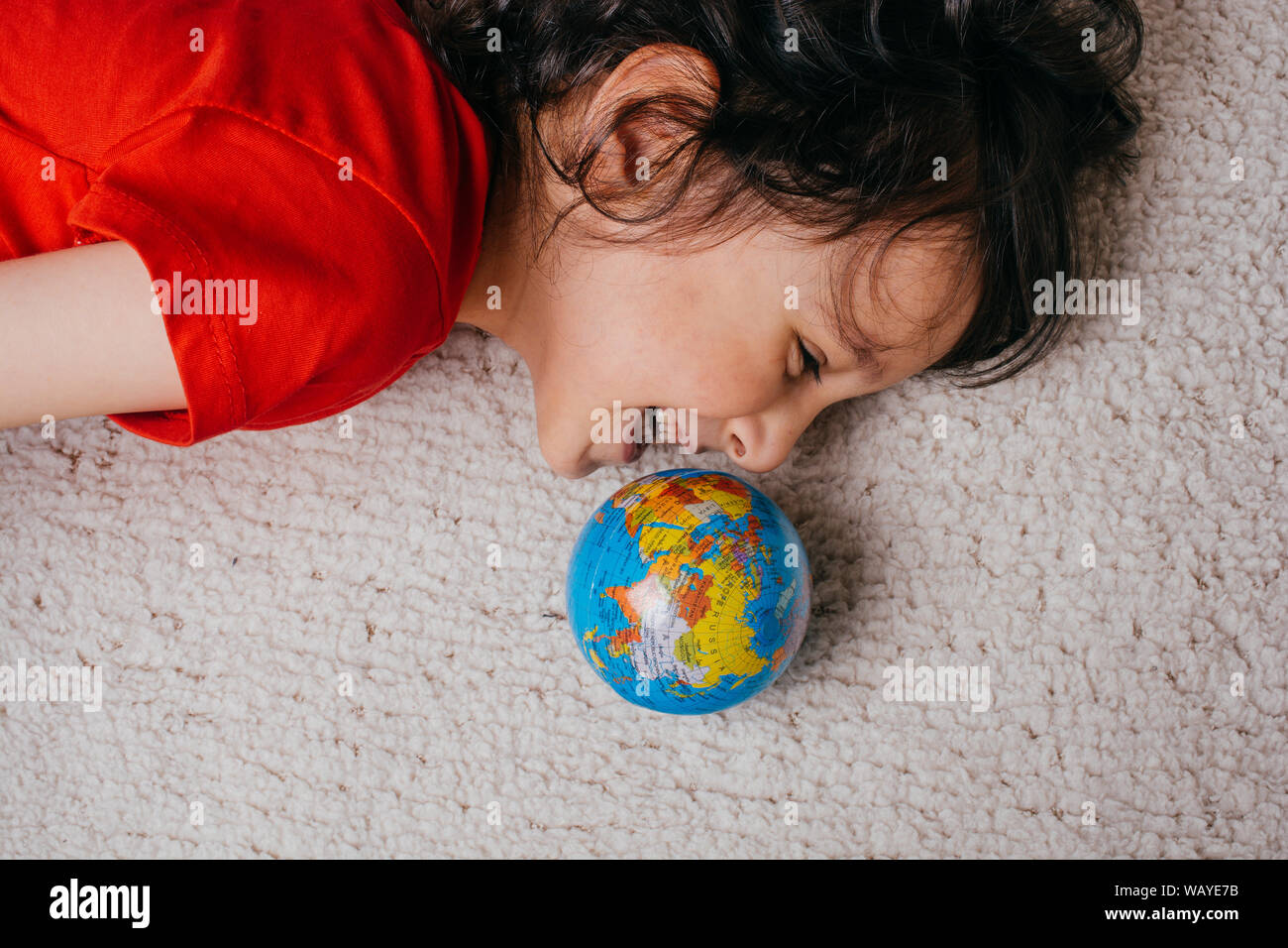 Earth globe beside boy Environment and save planet concept Stock Photo ...