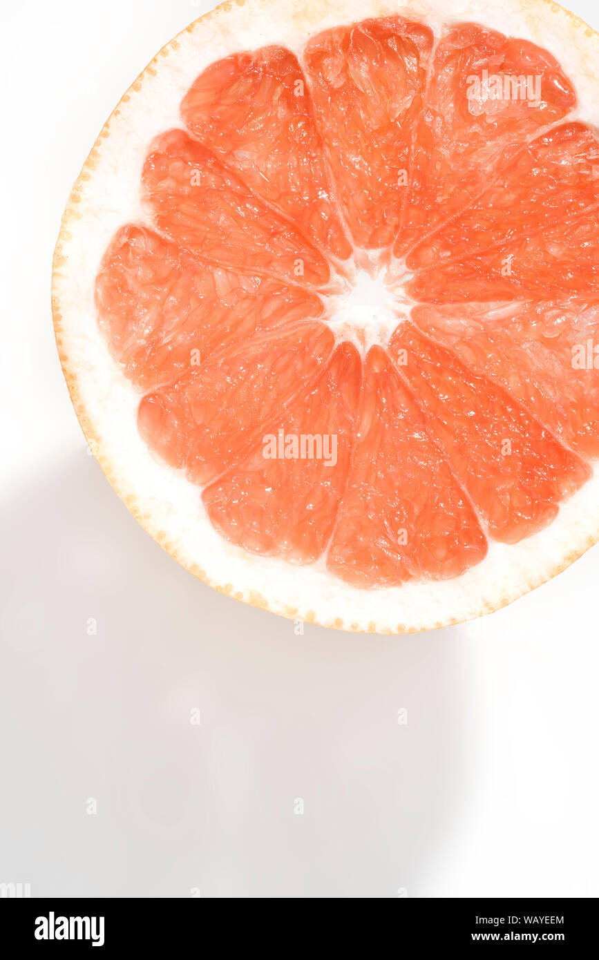 A slice of Pink Grapefruit Stock Photo - Alamy