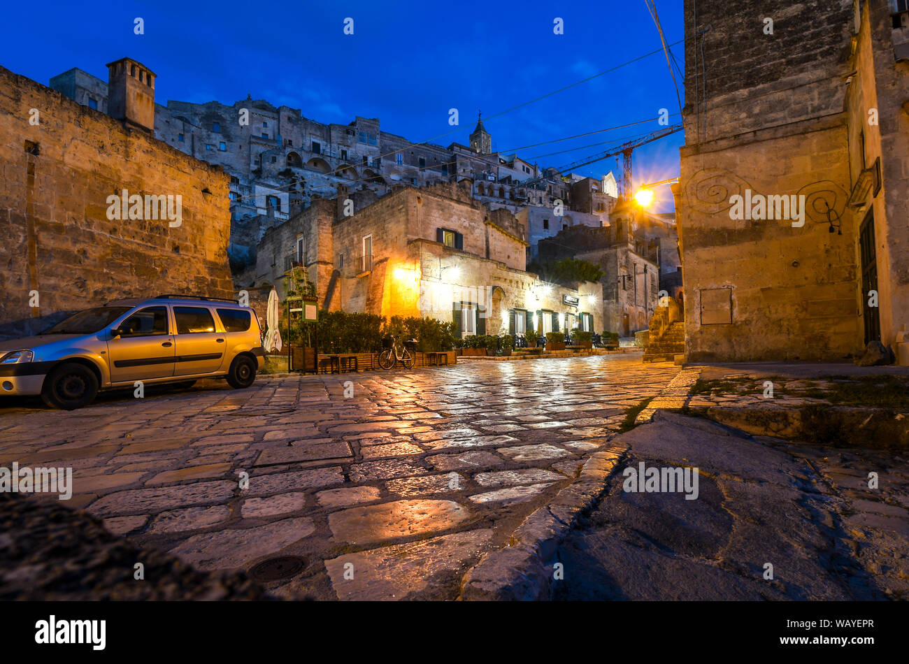 Night view, street level of an illuminated cafe in the historic ...