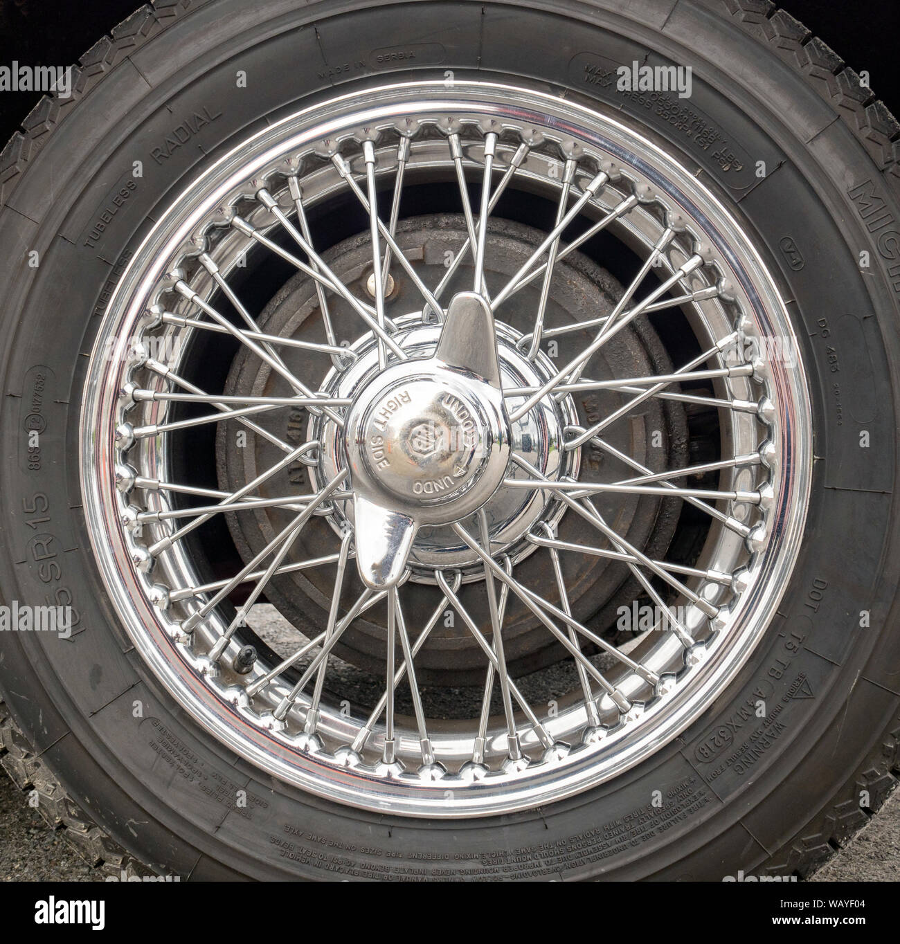 Detail of a chrome wire wheel on an MG Sports Car Stock Photo - Alamy