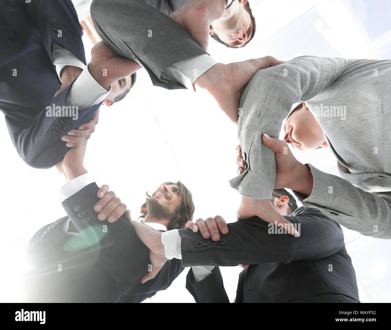 business team are taking each other's hands Stock Photo - Alamy