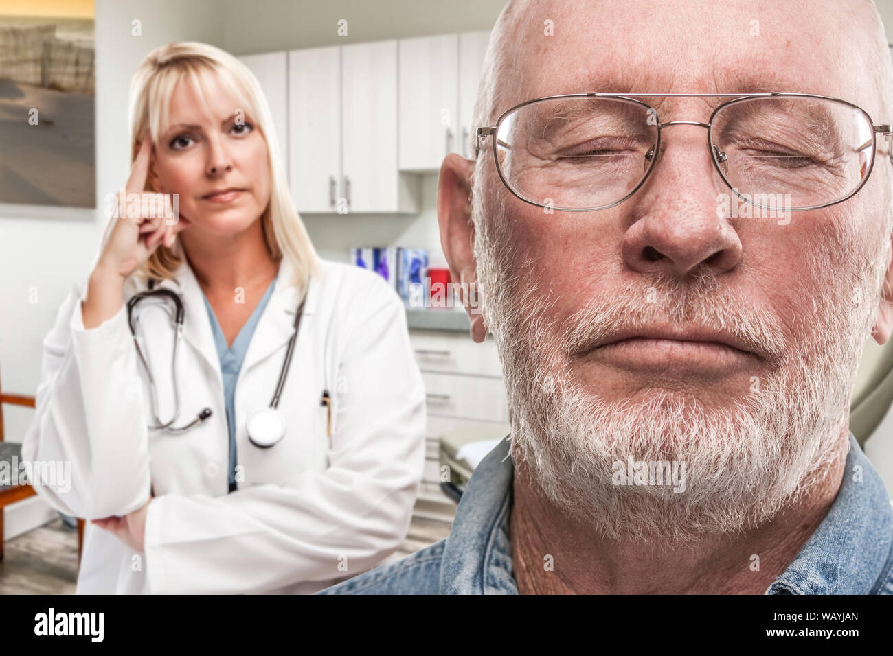 Empathetic Doctor Standing Behind Troubled Senior Adult Man In Office ...