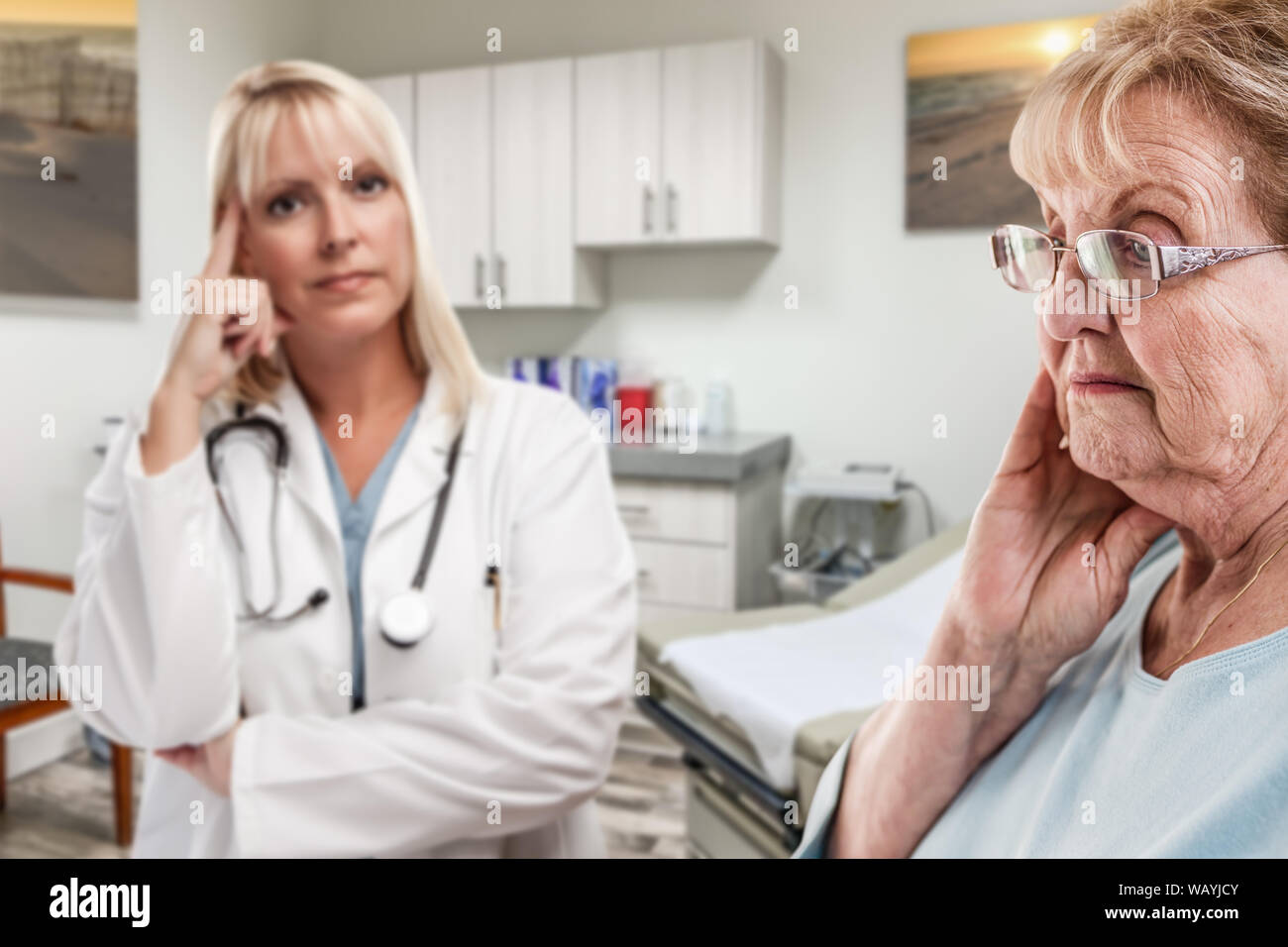 Doctor concerned elderly woman hi-res stock photography and images - Alamy