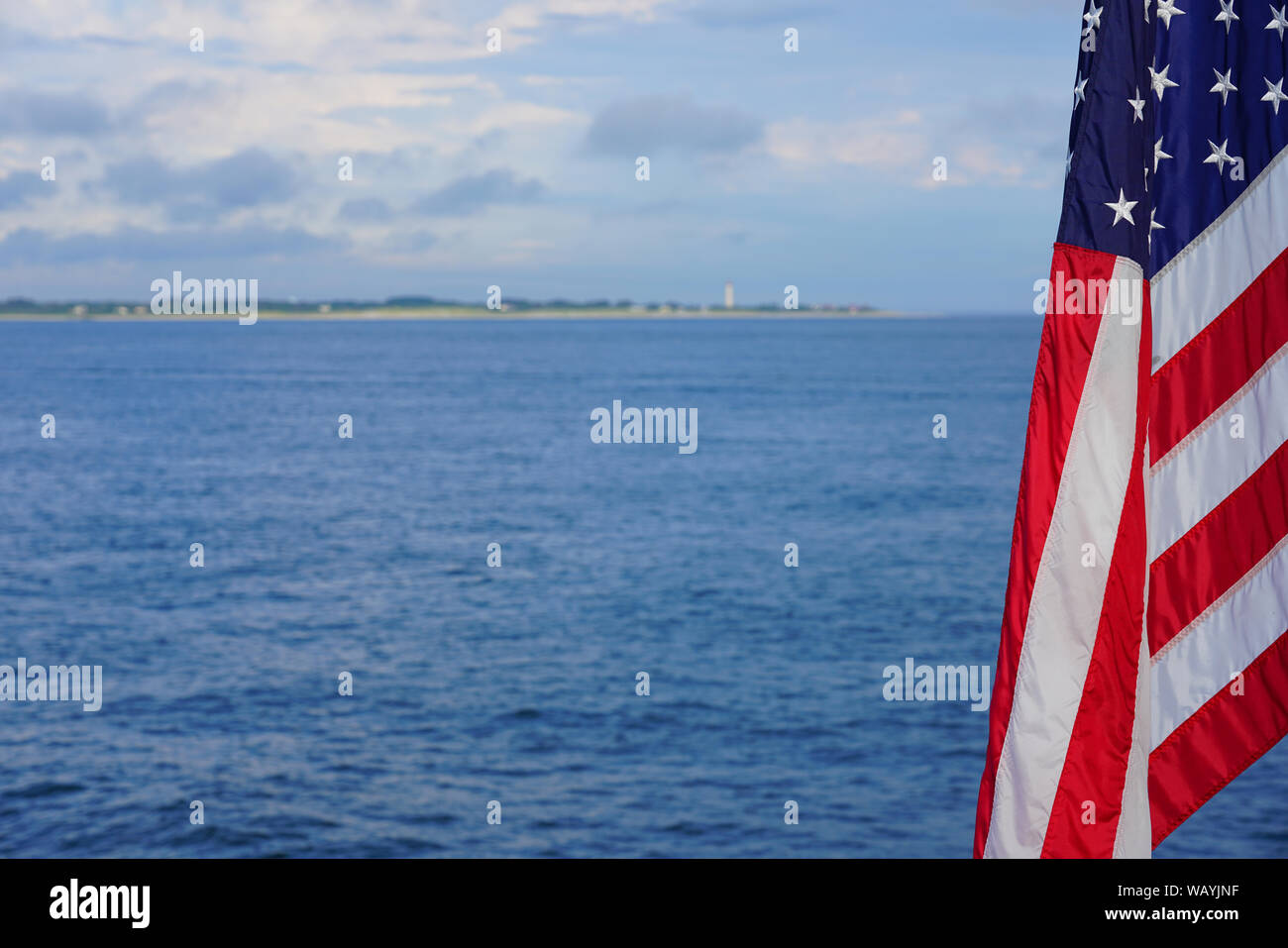 American flag of the United States of America floating off a ferry on ...