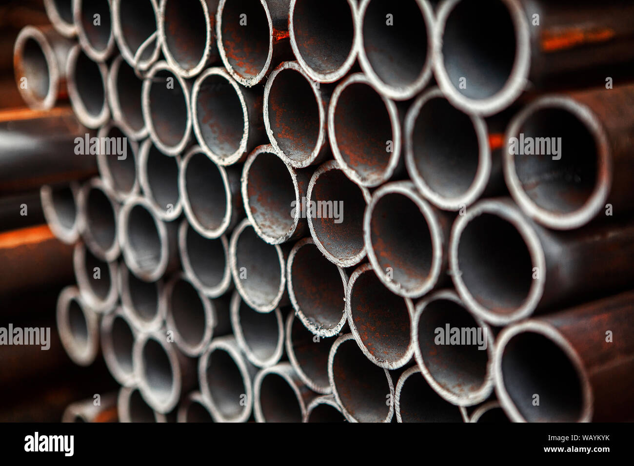 stack of empty steel pipes Stock Photo - Alamy