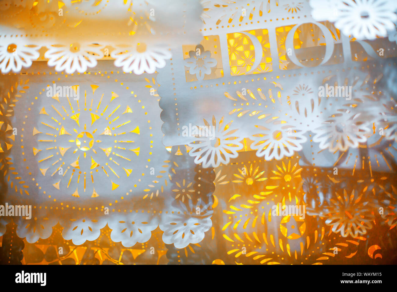 handmade paper curtains on yellow background Stock Photo - Alamy