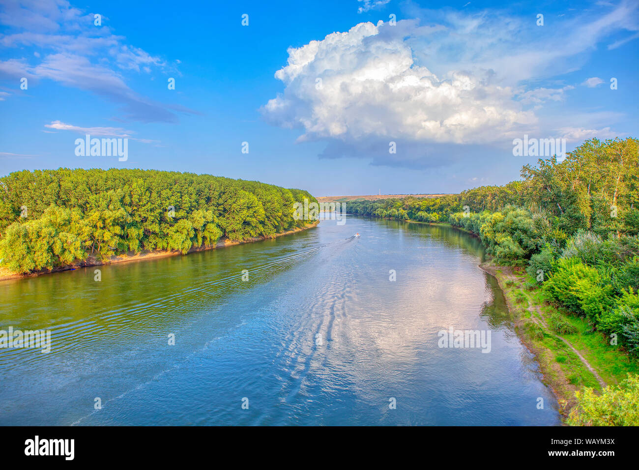 idyllic nature with reflection of blue sky in the river water Stock ...