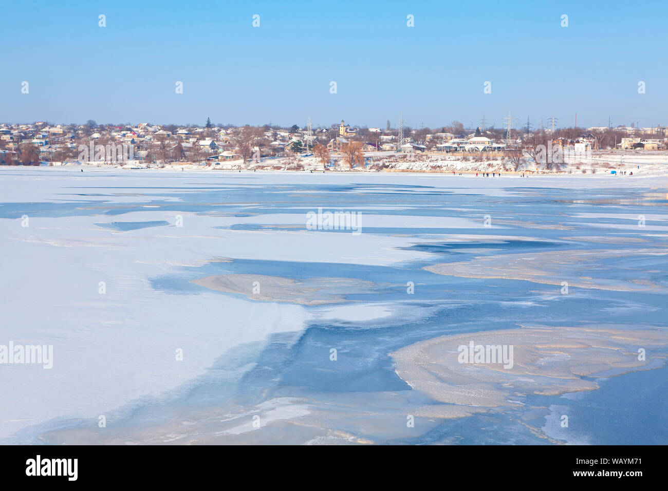 winter landscape with village and frozen lake Stock Photo - Alamy
