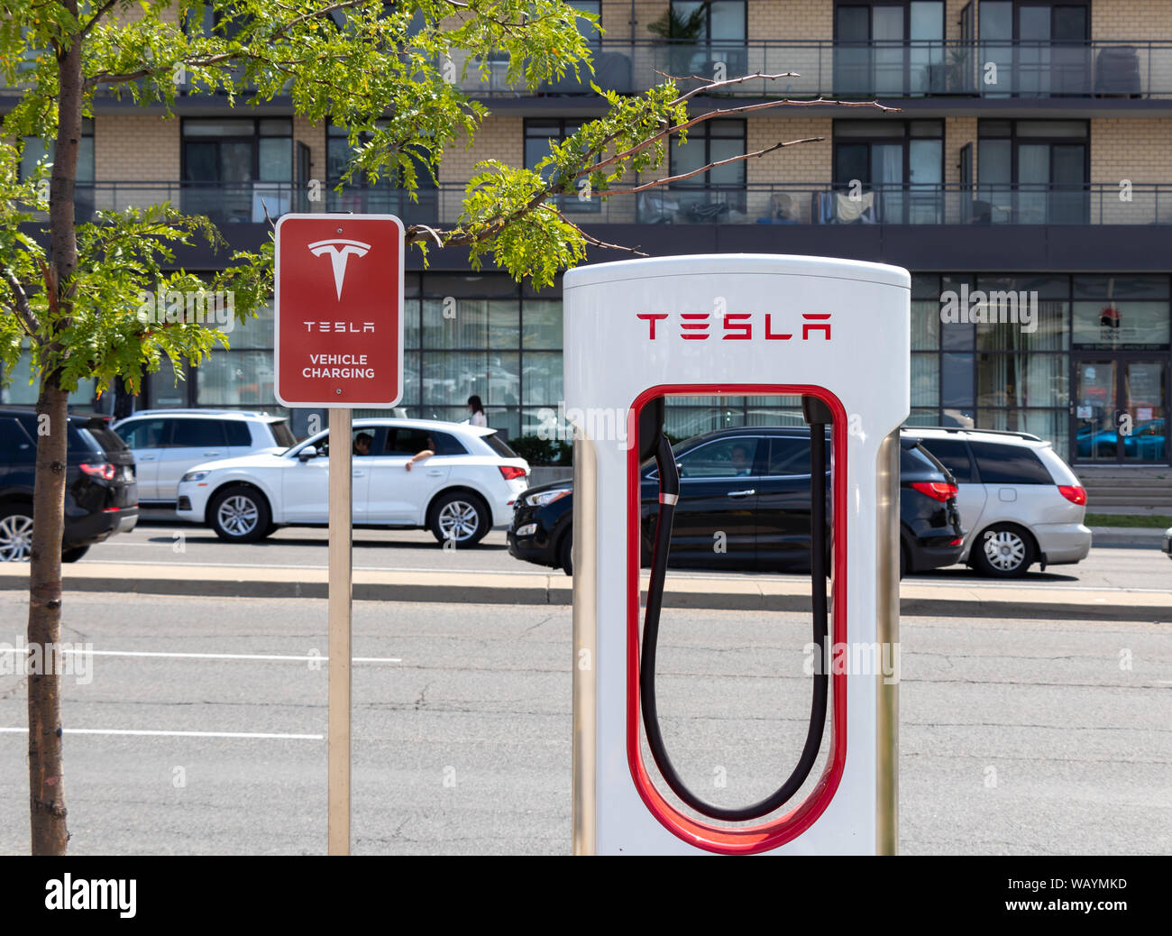 Tesla Supercharger Stall in-front of a busy road Stock Photo - Alamy