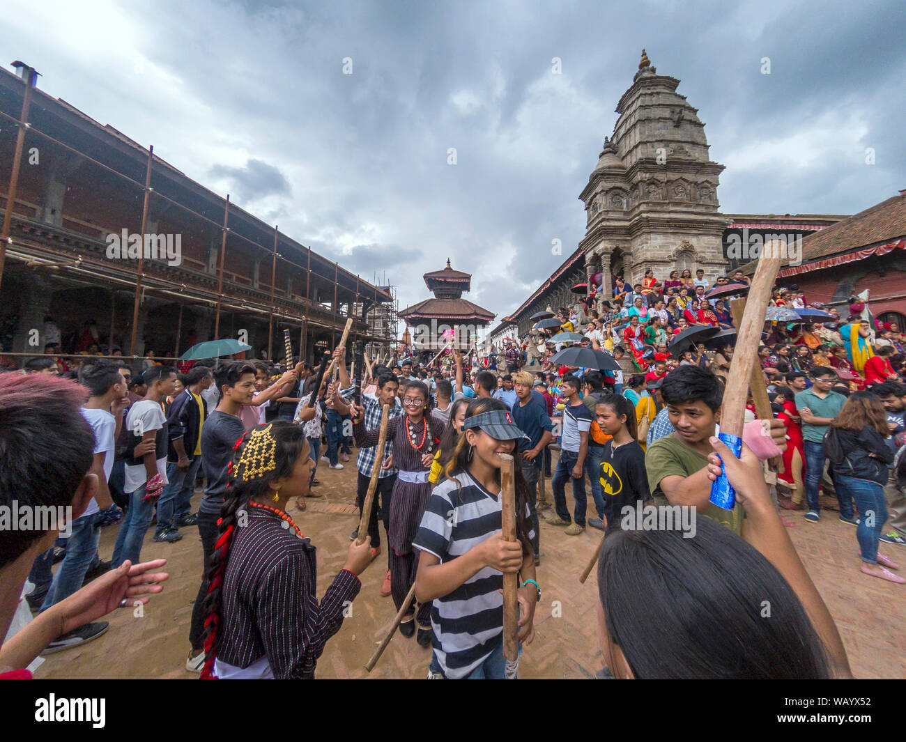Participants hold bamboo sticks during the Festival.People celebrate ...