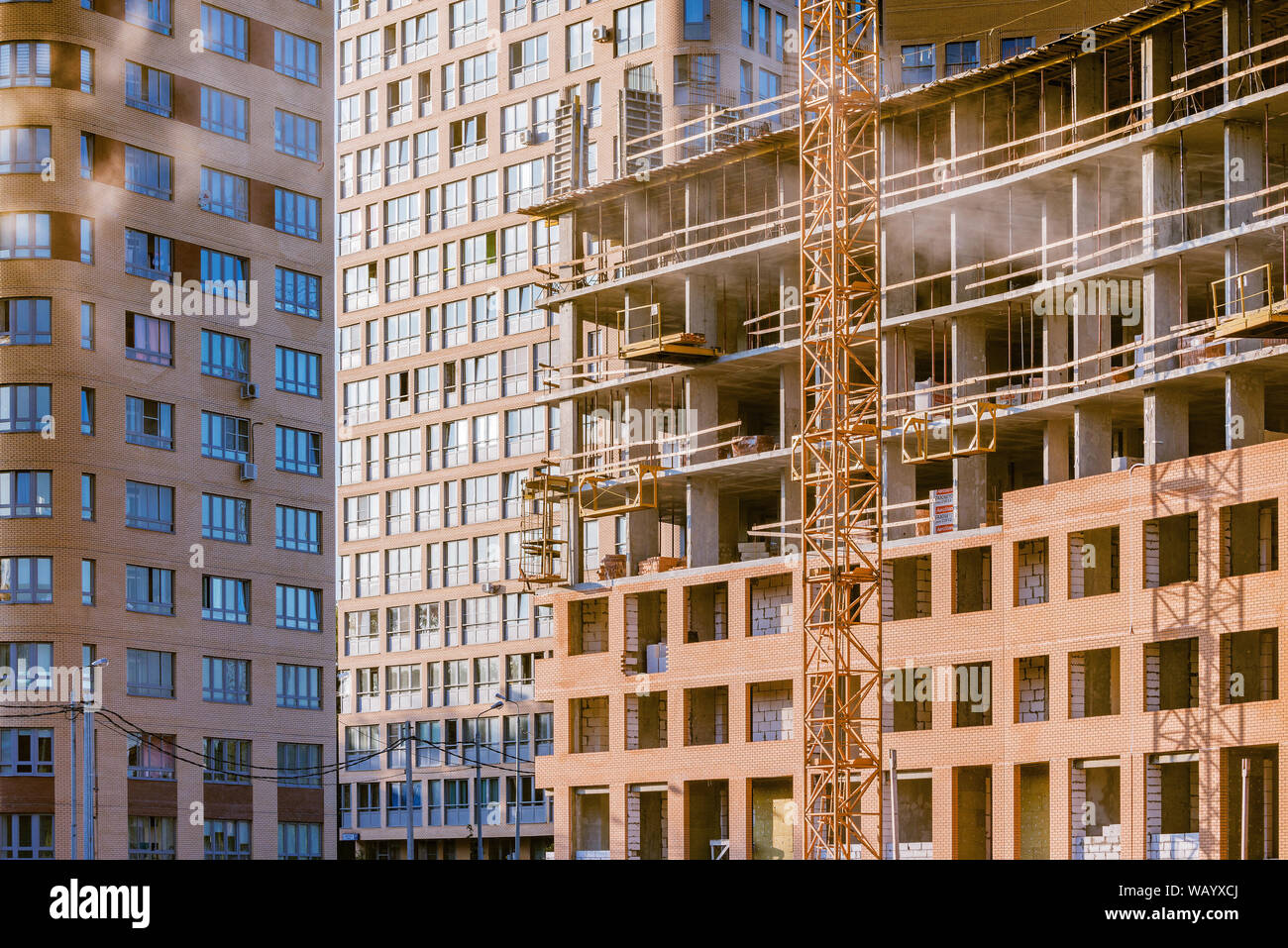 New modern buildings by the construction site Stock Photo - Alamy