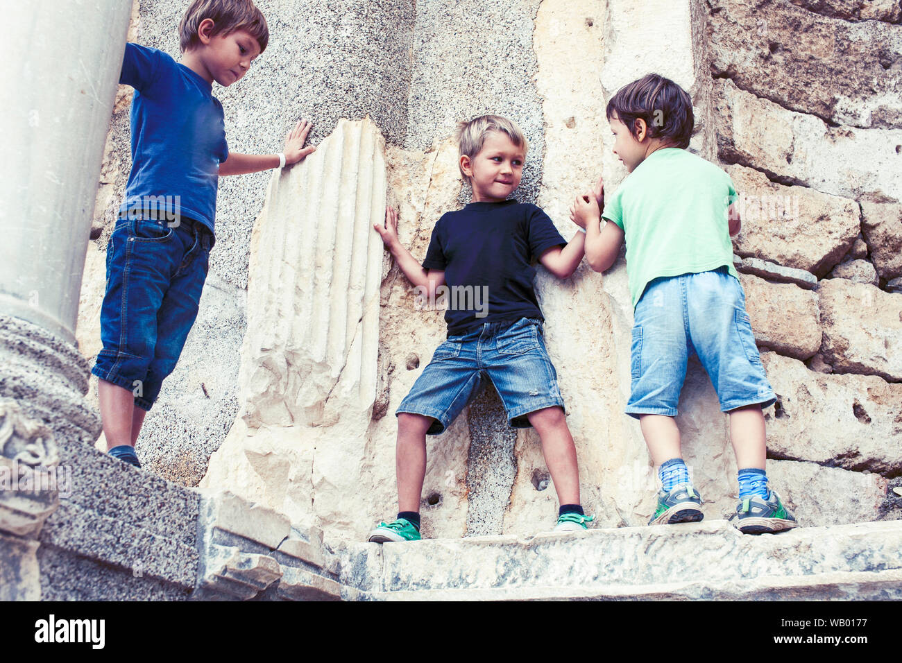 little boy exploring ancient architecture, lifestyle people on summer ...
