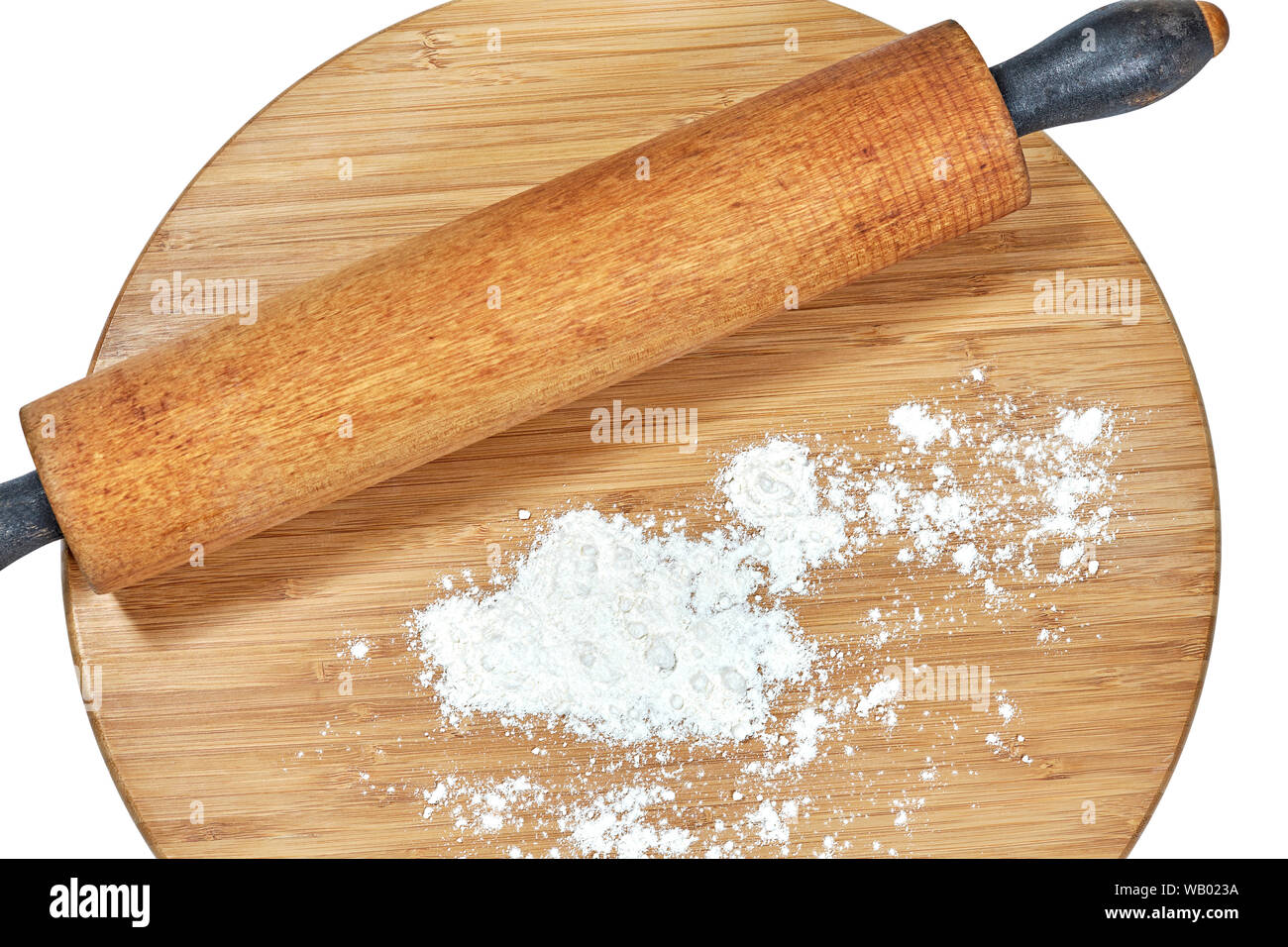 A wooden rolling pin on a bamboo cutting board isolated on white Stock ...