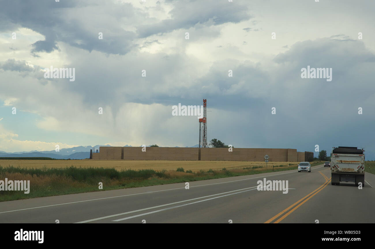 Oil Derrick, pumping and drilling well in field Stock Photo - Alamy