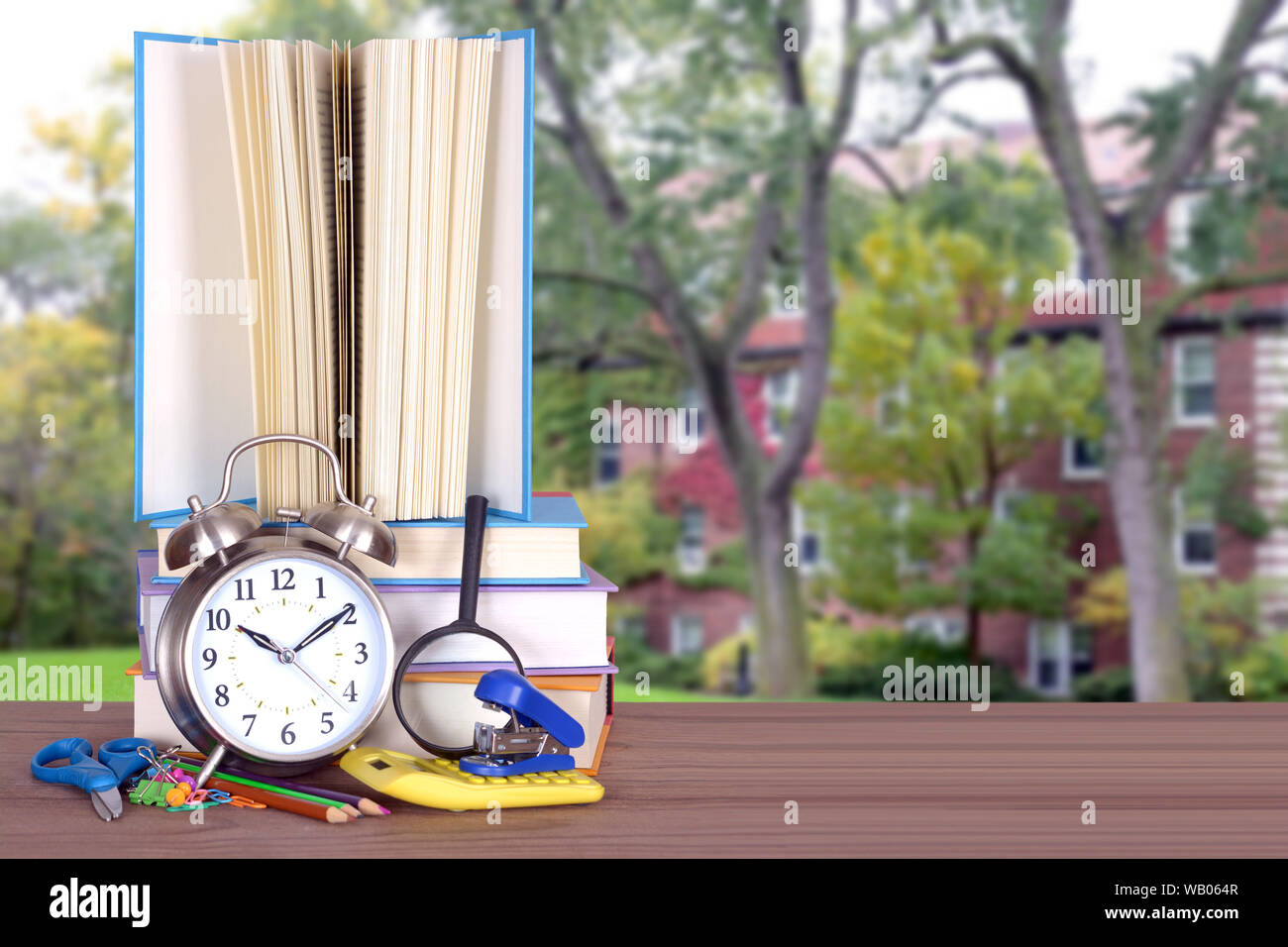 concept of Back to School with empty campus, books, and school supplies ...