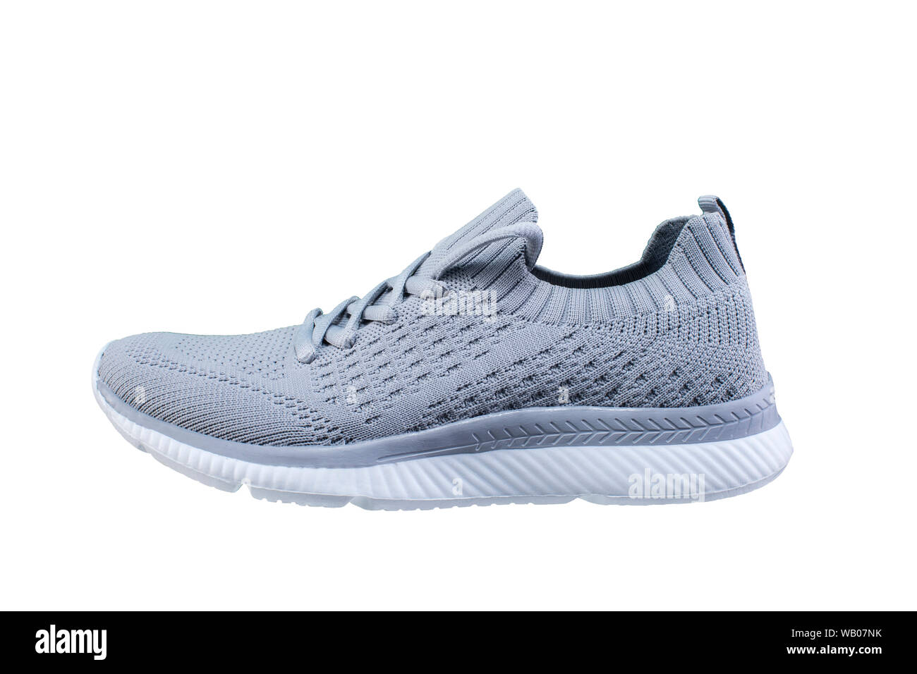 Gray sneakers. Sports shoes side view on a white background Stock Photo ...