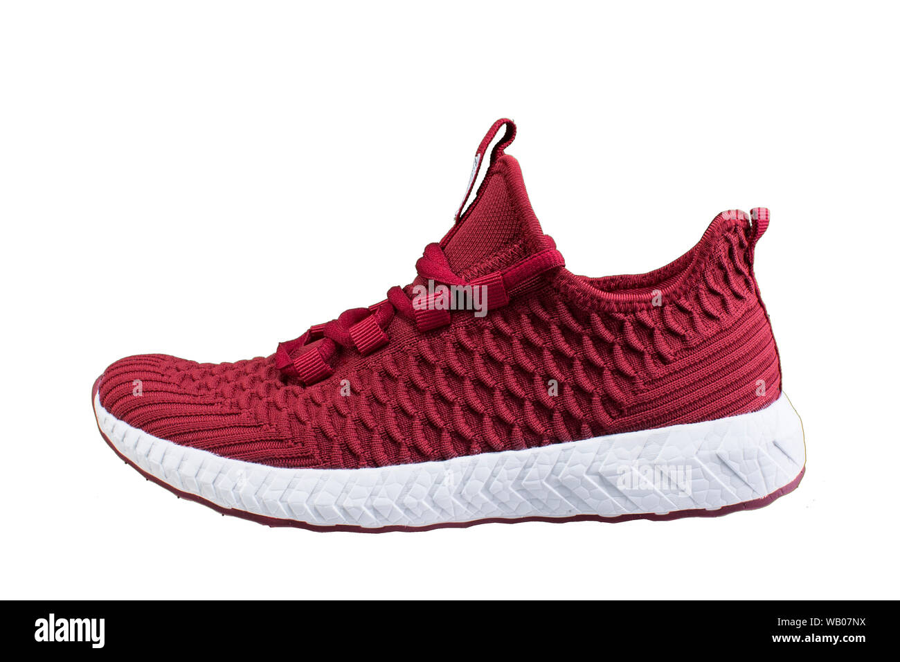 Red sneaker. Sports shoes side view on a white background Stock Photo ...