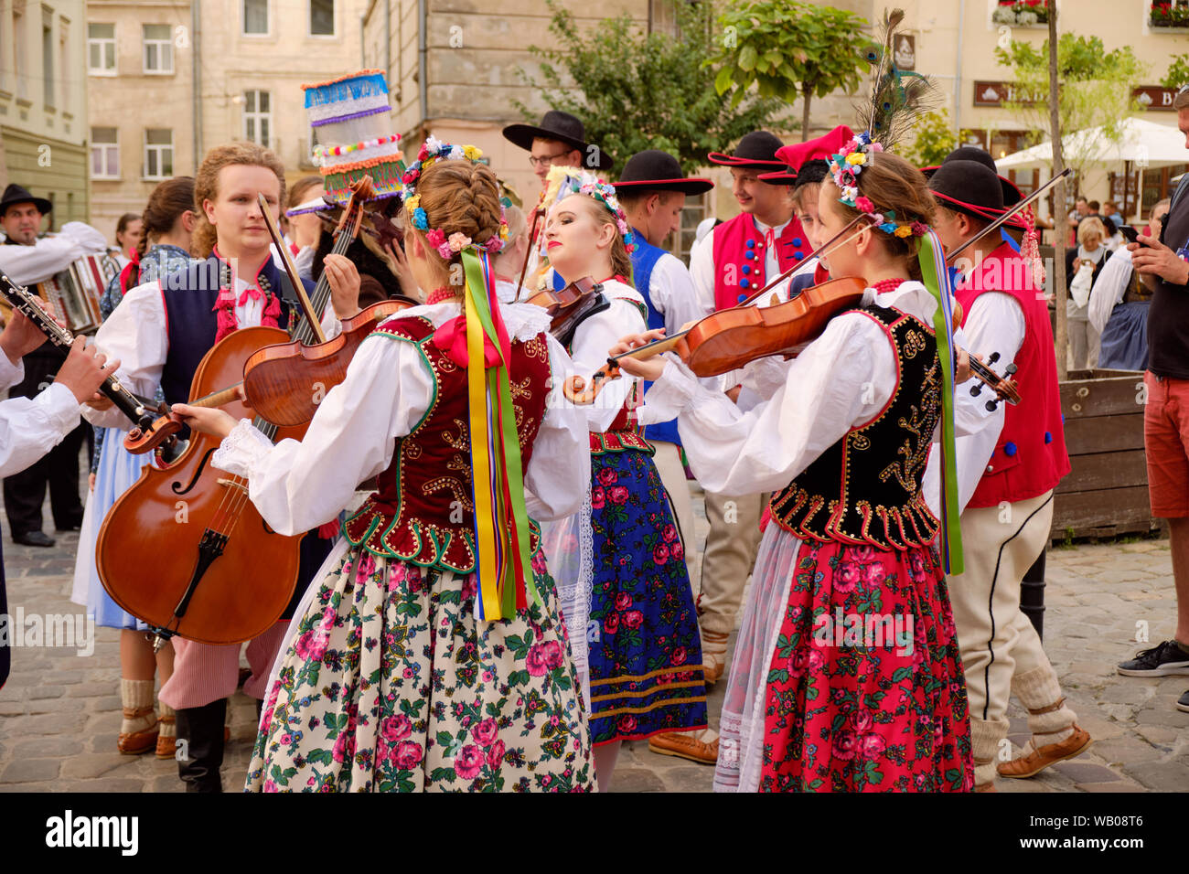 Polish Folklore group Marynia in bright costumes Musicians performing ...