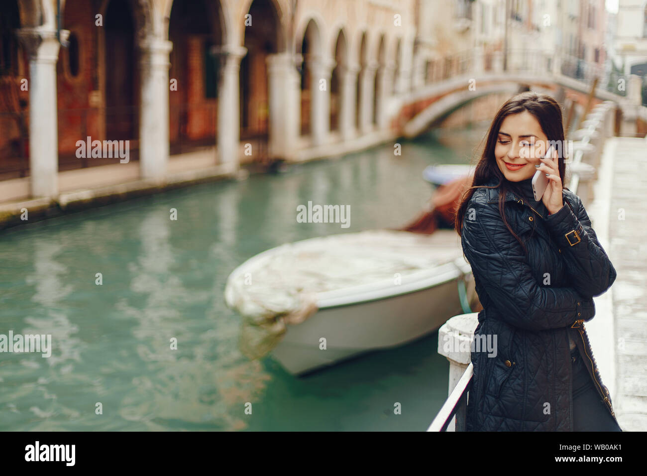 girl talking on the phone and taking pictures in Venice Italy Stock ...