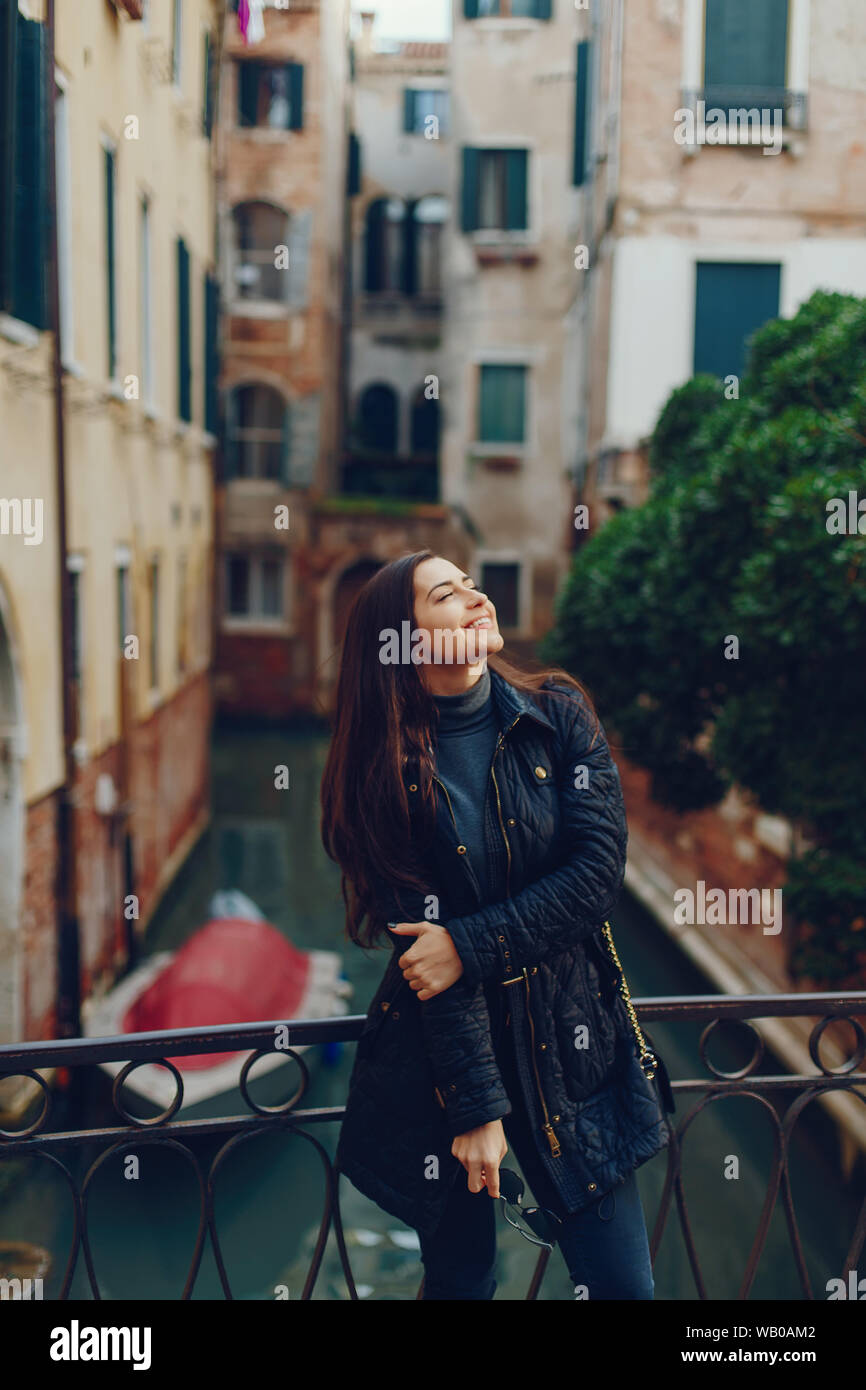 female tourist walking around and exploring venice in the early spring ...