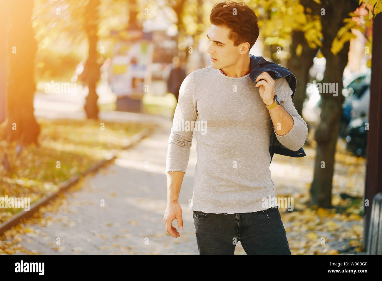 stylish man walking through the city by himself Stock Photo - Alamy