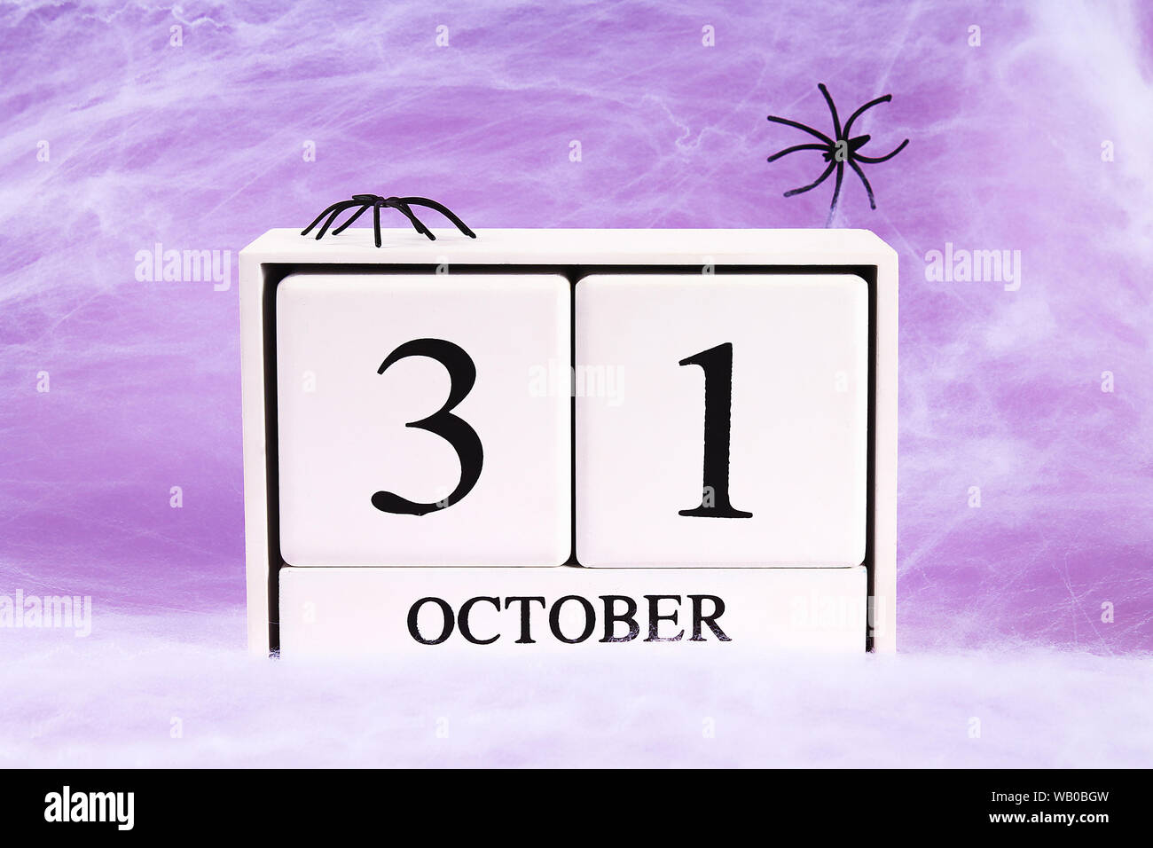Halloween holiday concept. White spider web with two black spider web ...