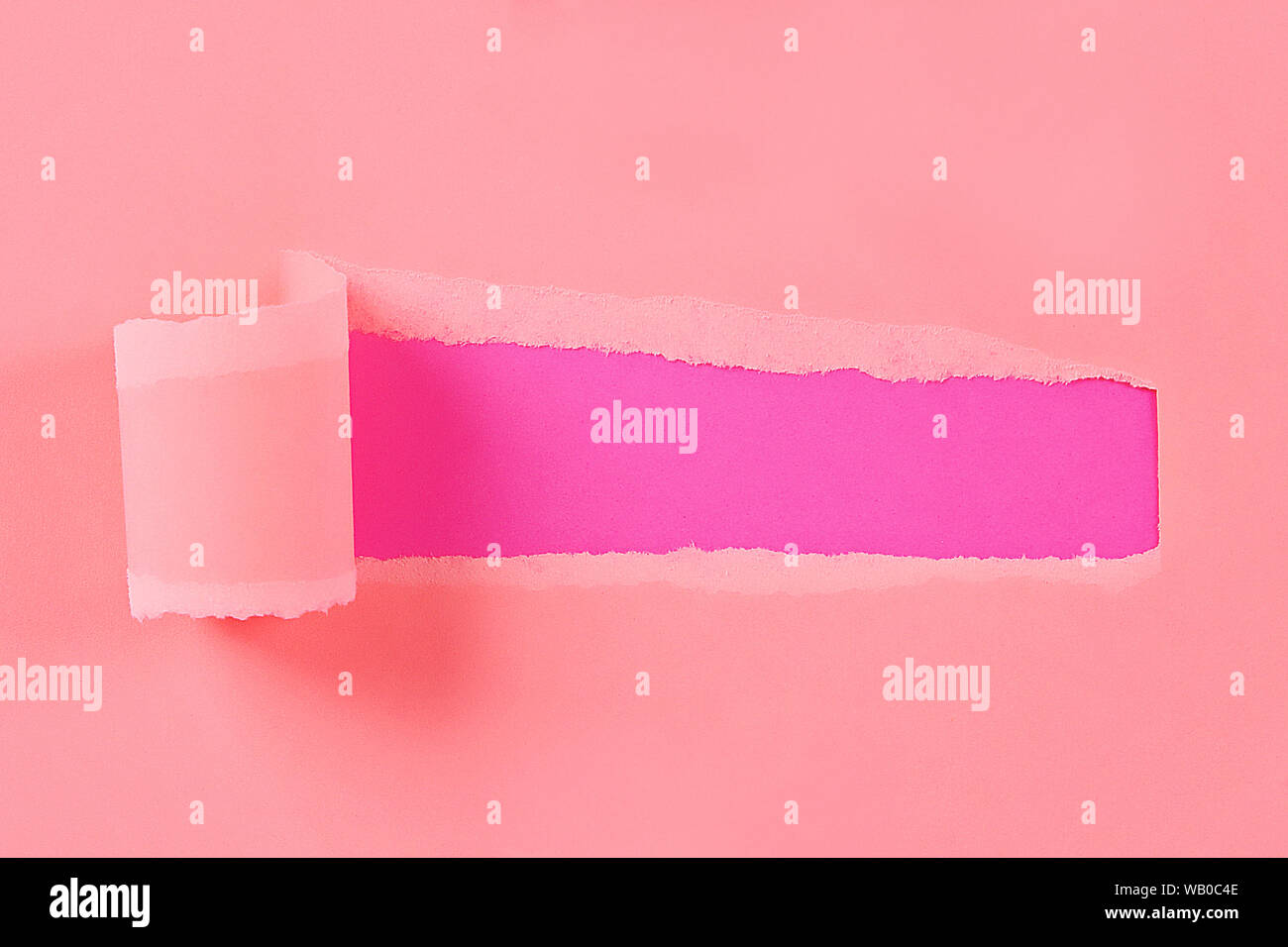 Torn color wrapped paper with space for your message. Hole ripped in ...