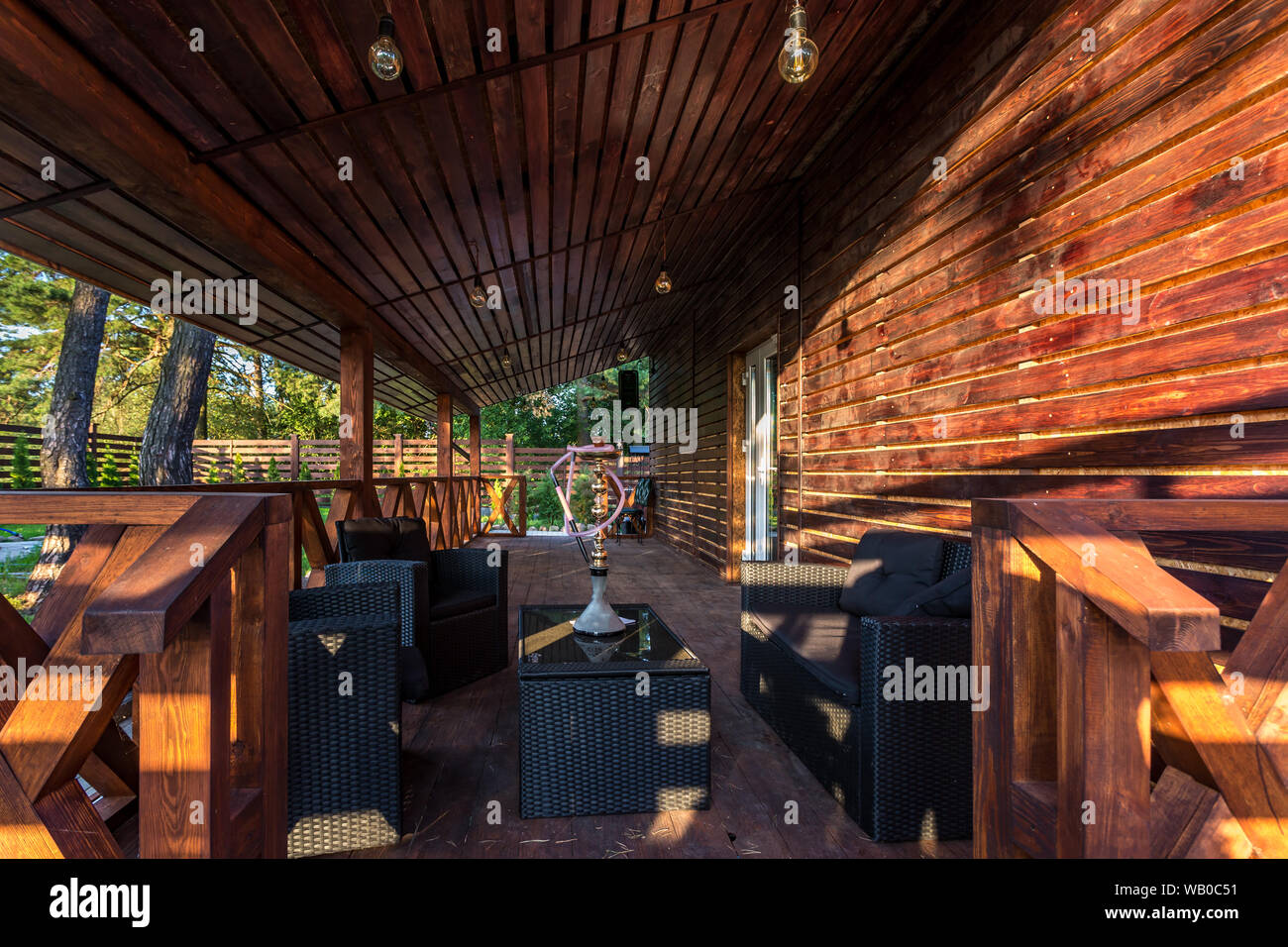 interior of empty hall veranda in wooden village vacation home with ...