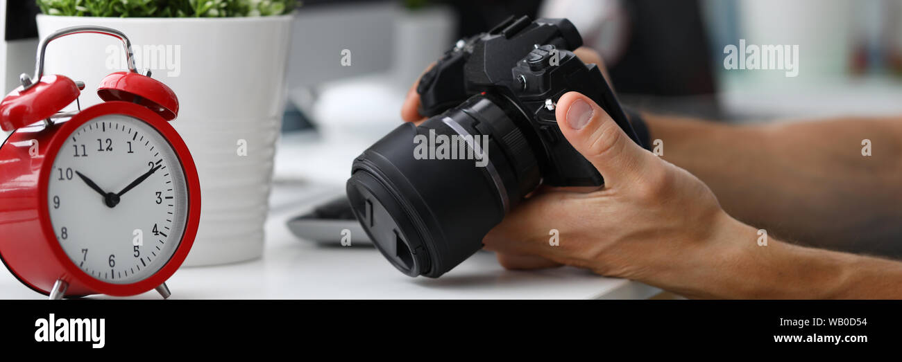 Hand photo camera office. Computer technology Stock Photo - Alamy