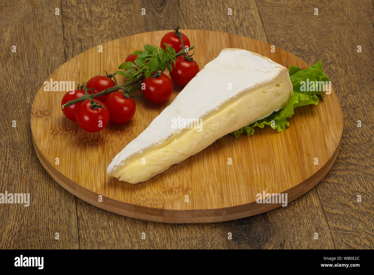 Brie cheese triangle served salad leaves Stock Photo - Alamy