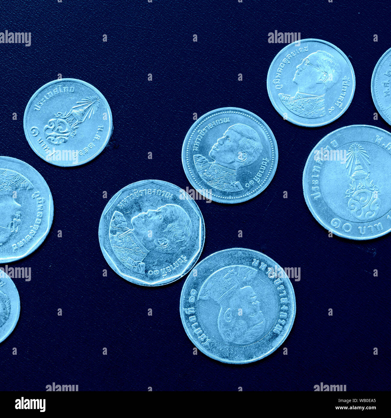 Thai Baht coins blue color toned close up, top view, square crop Stock ...