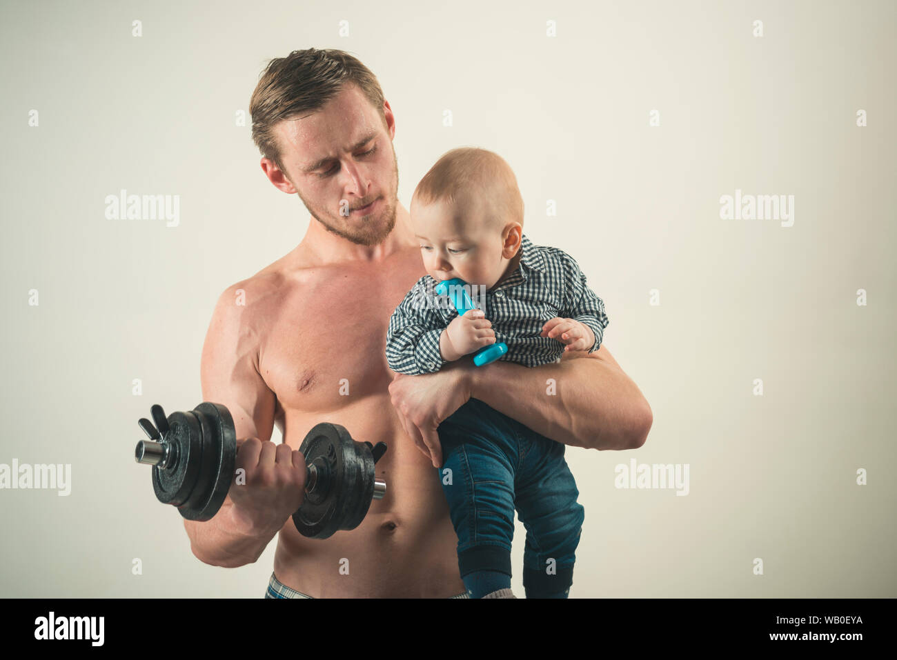 Healthy family lifestyle. Father and child training together. Strong ...