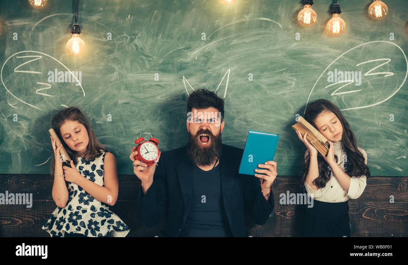 High school or college students studying and reading together in ...