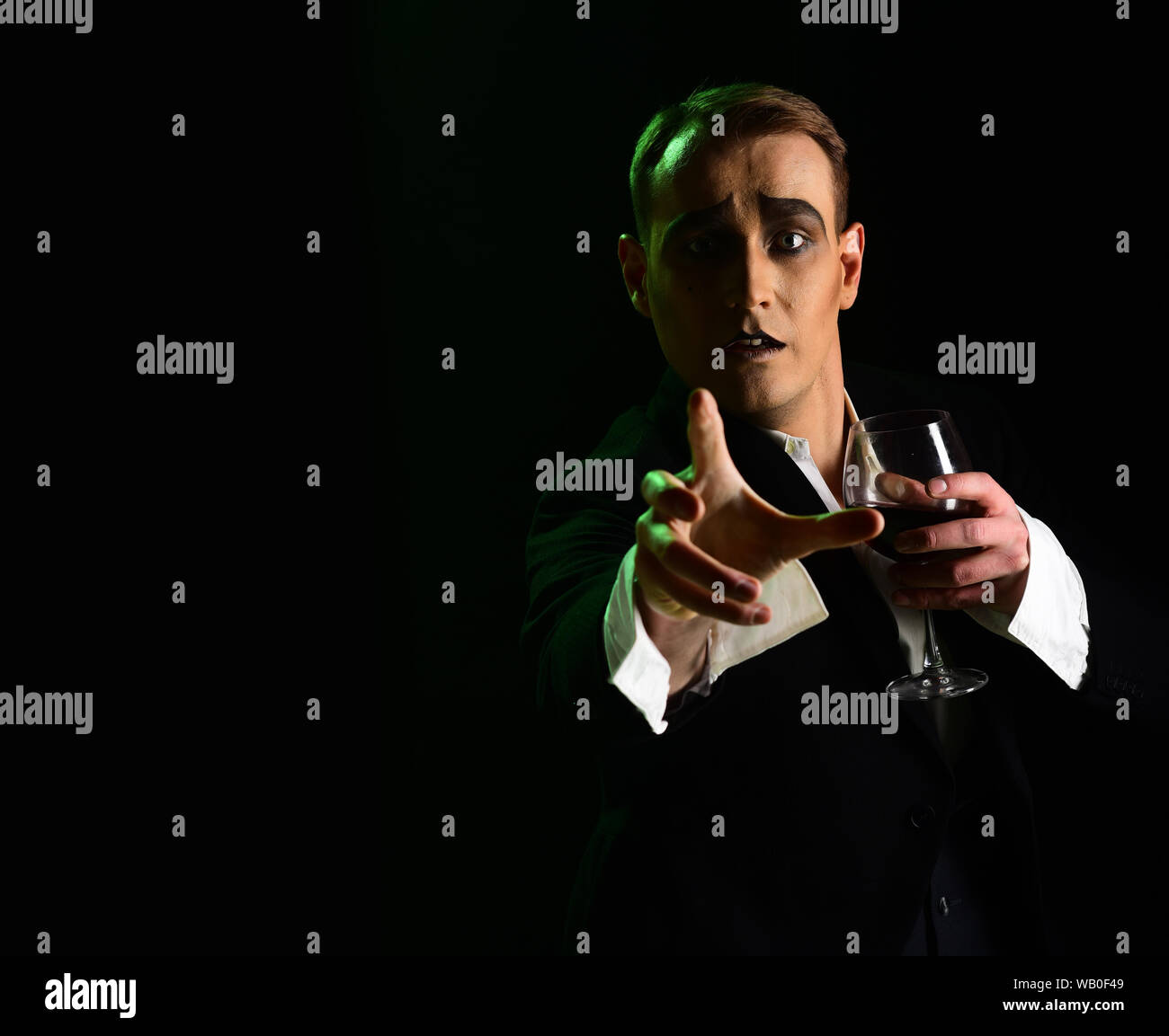 Where are you. Stage actor pantomime drinking wine. Comedian with mime ...
