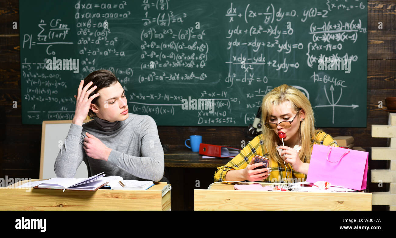 High school college students studying and reading together in class ...