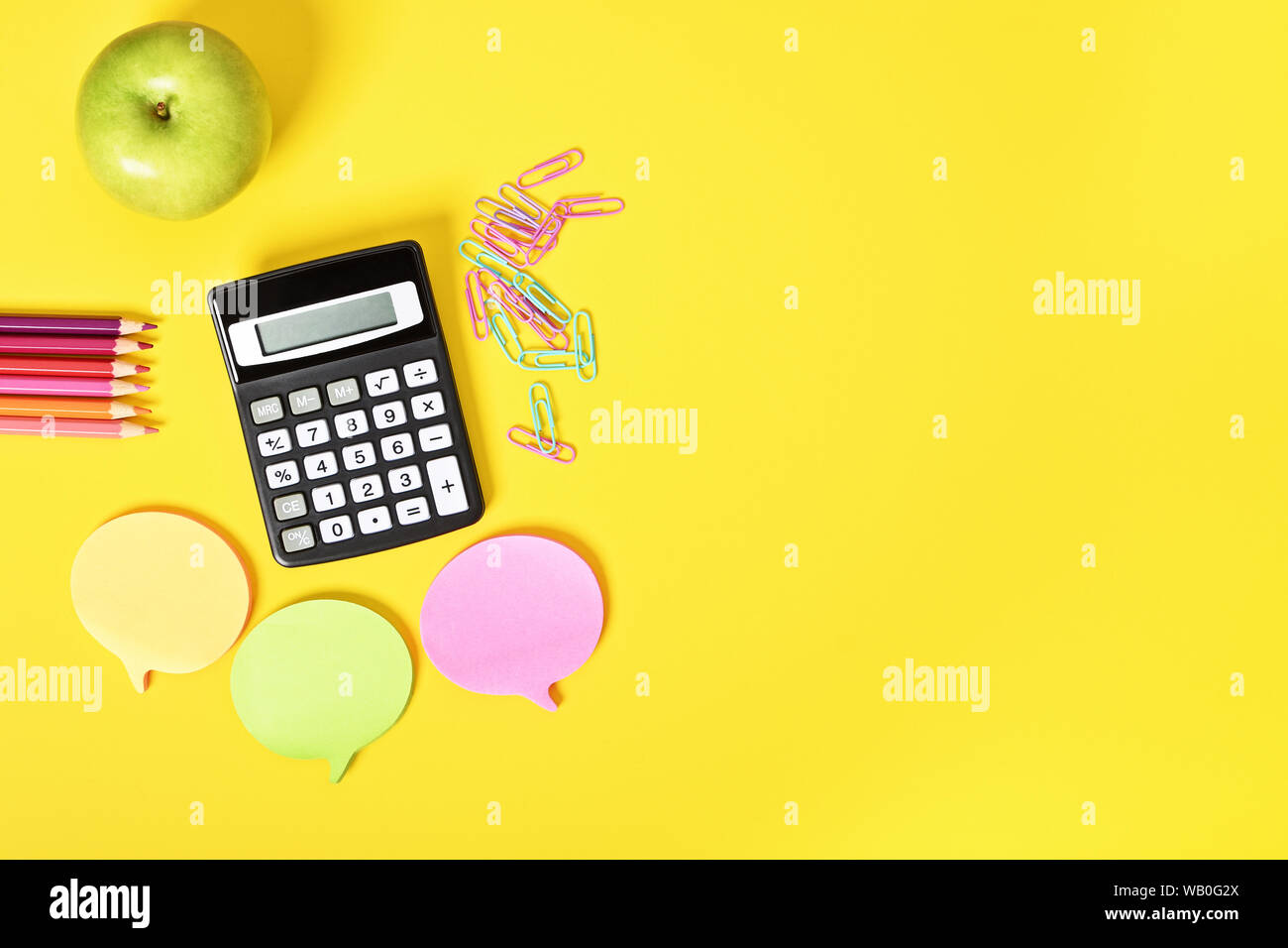 Math accessories for class. Flat lay of calculator, sticky notes and ...