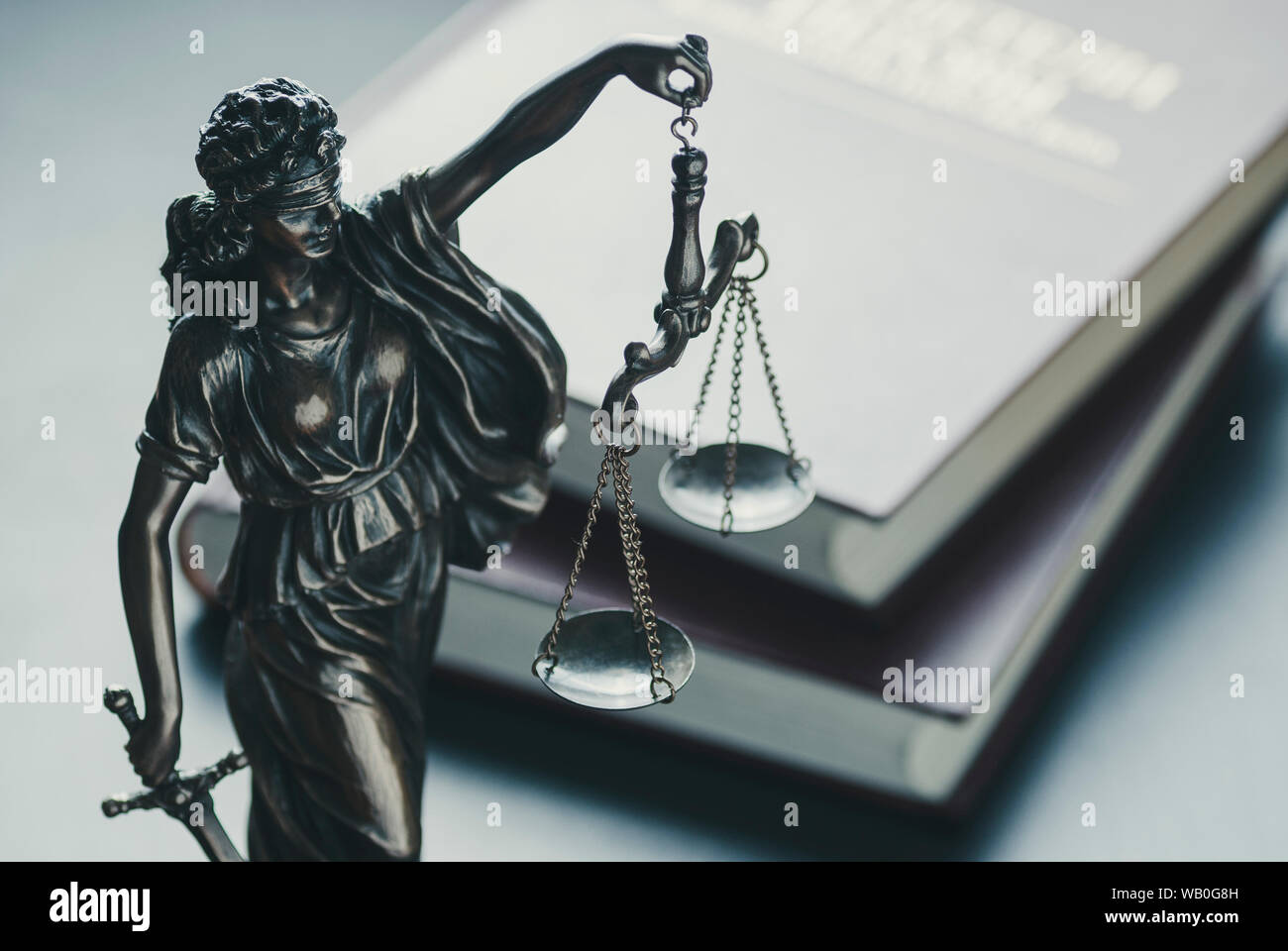 Statue of the figure of Justice holding scales and a sword high angle ...