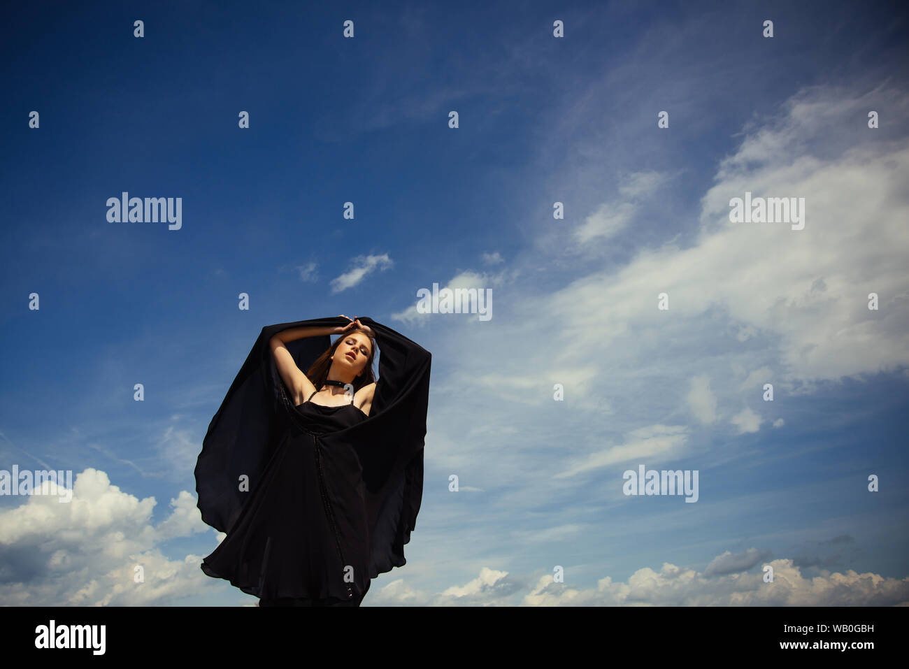 Free and happy. Future success. Girl on blue sky. Beauty and fashion ...