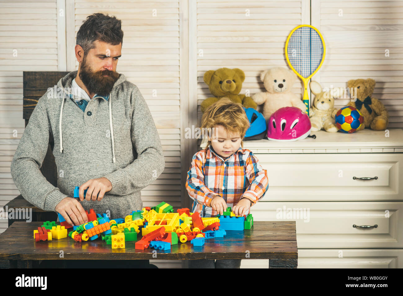 father small child play with constructor. happy childhood. Care and ...