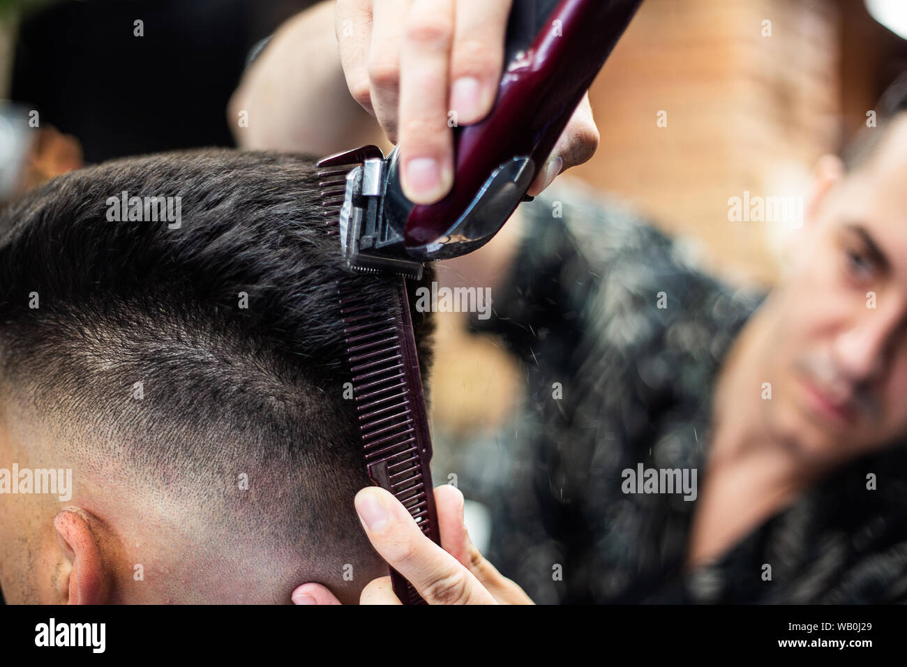 Man getting beard trimmed by barber hi-res stock photography and images ...